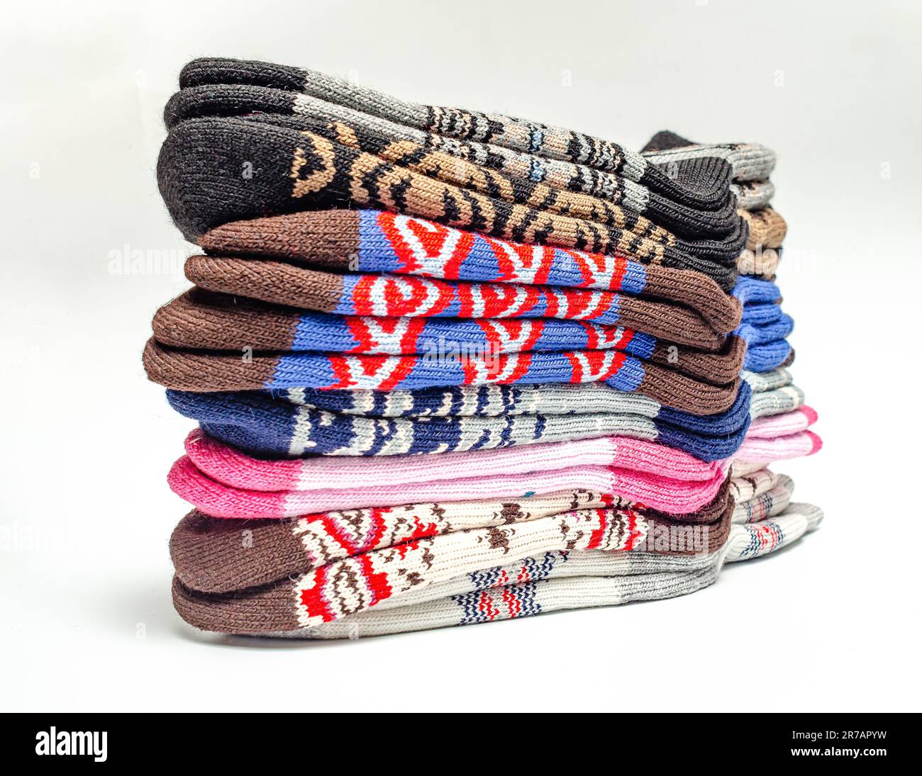 Stack of warm wool winter socks of different colors and patterns Stock ...