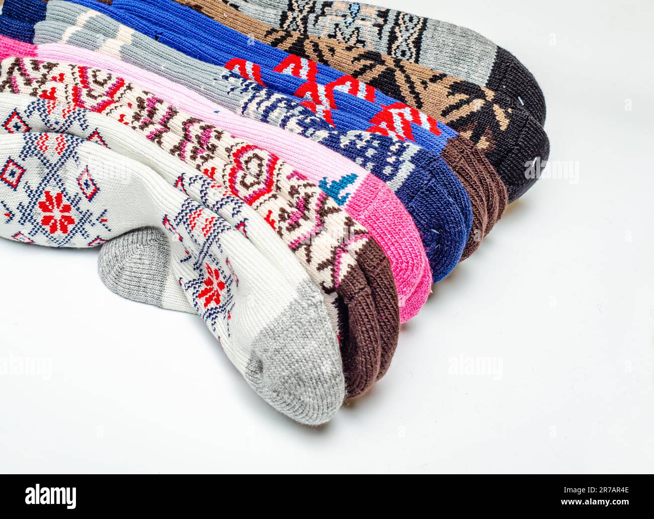 Warm wool socks folded on white background Stock Photo - Alamy