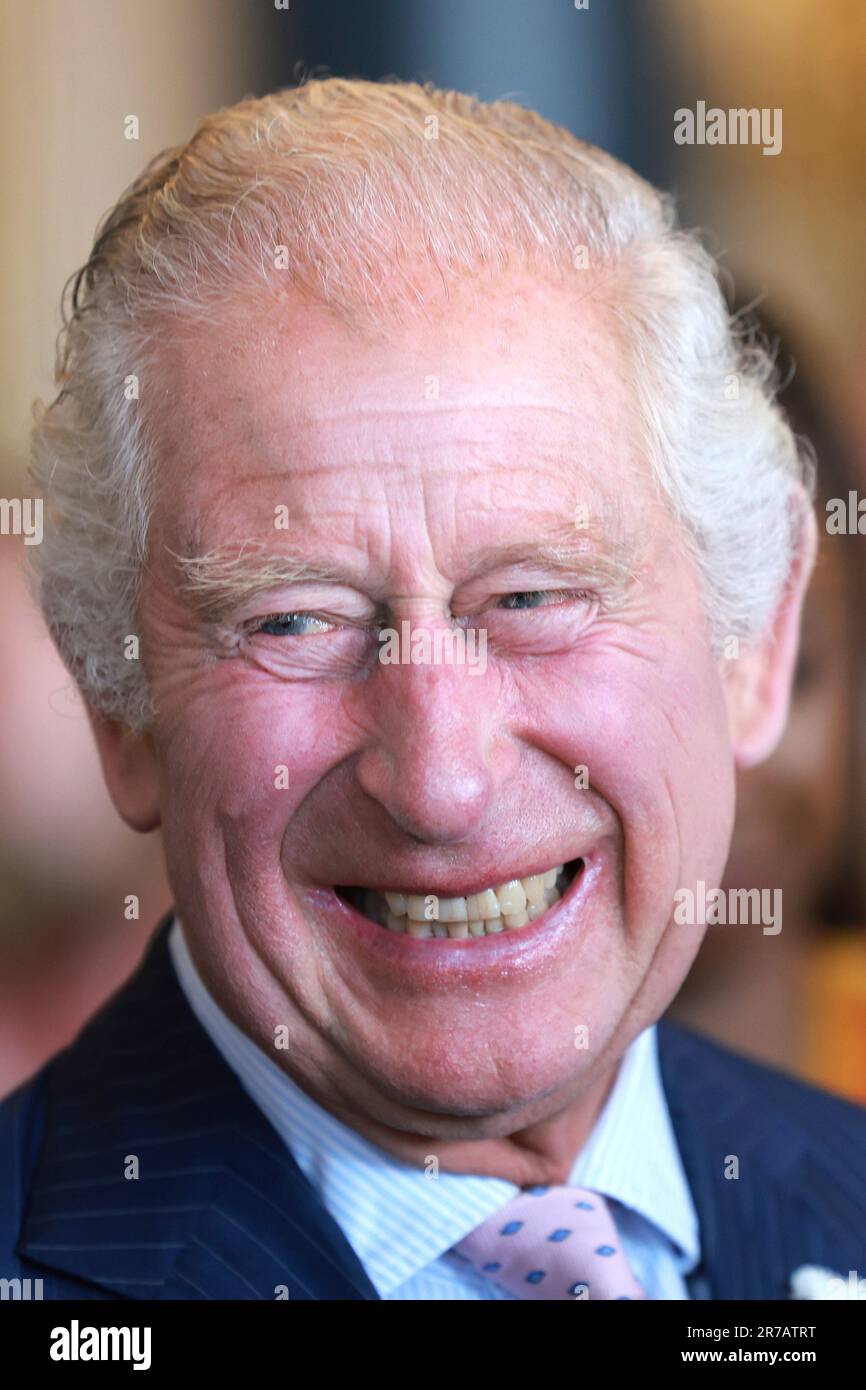 Britain's King Charles III poses for pictures during a reception to ...