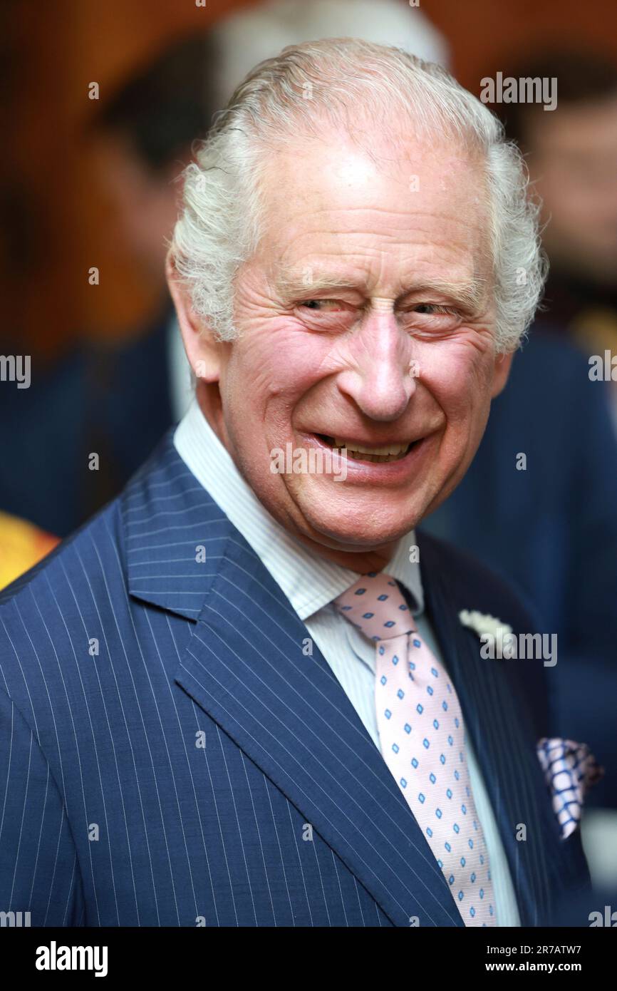 Britain's King Charles III poses for pictures during a reception to ...