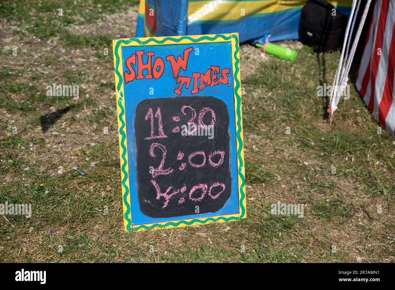 A board announced the show times for the next Punch & Judy Show Stock ...