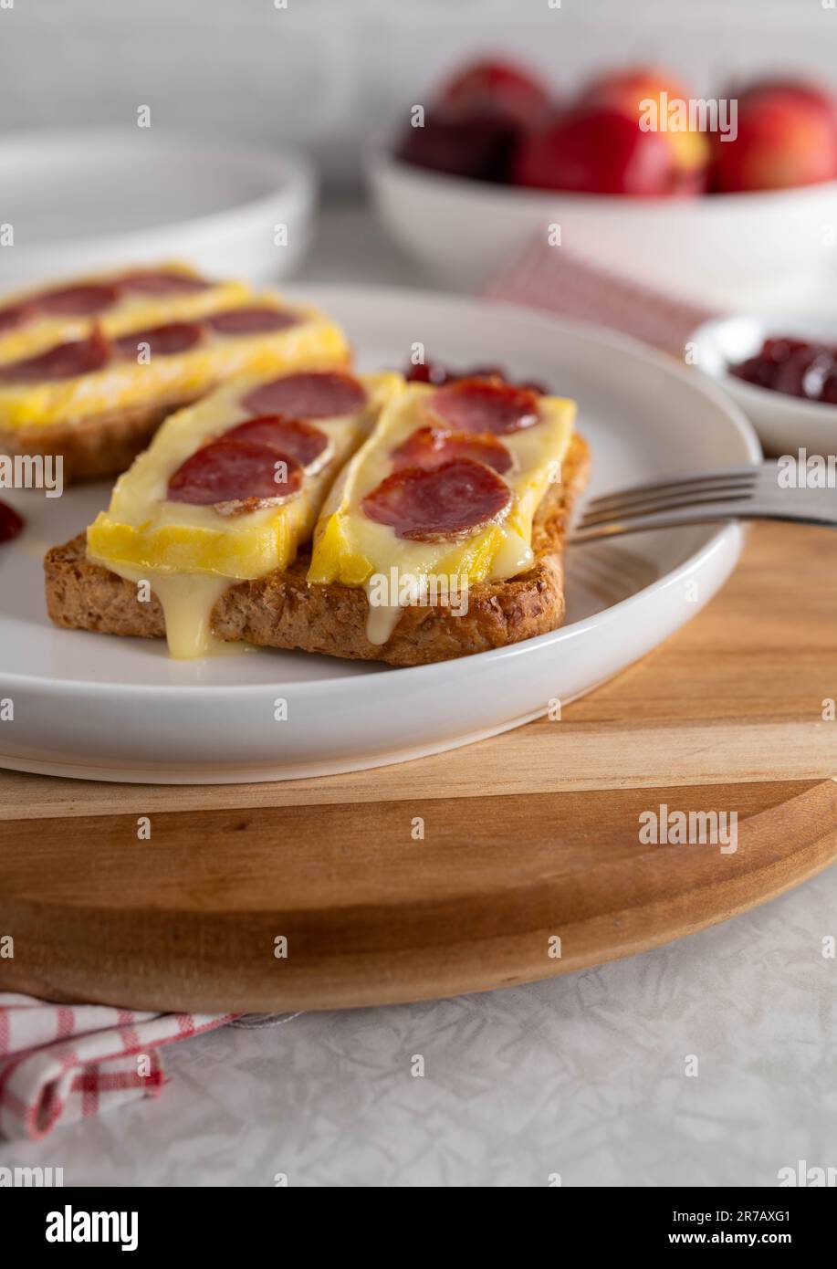 Open faced grilled cheese sandwich with brie, spanish salami. Served ...