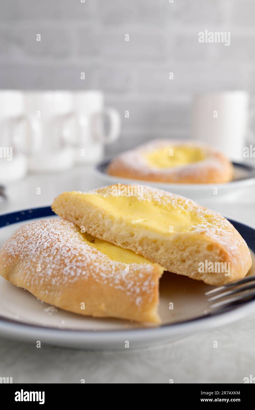 Yeast pastry with pudding filling Stock Photo - Alamy