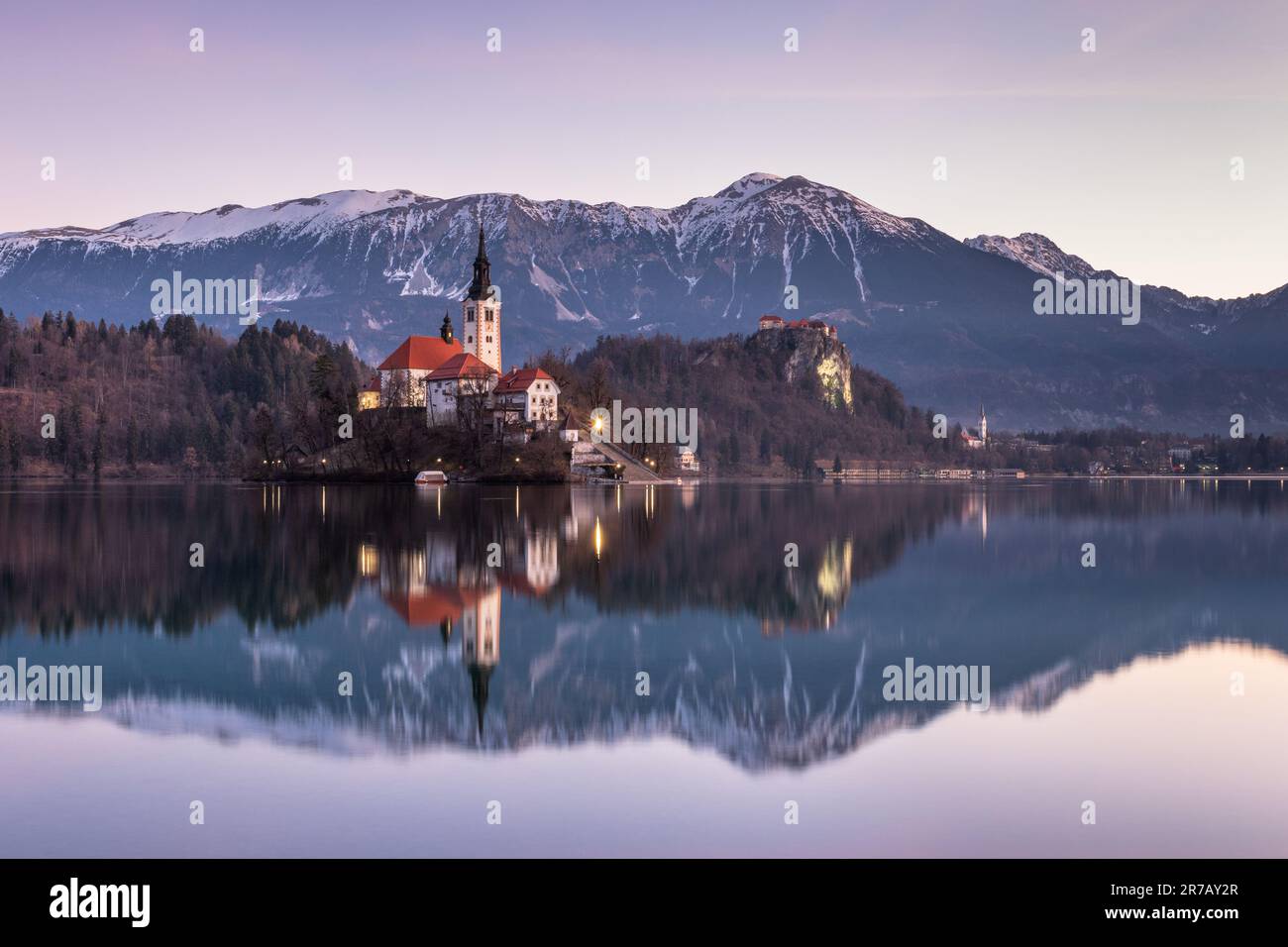 Sunrise reflections at Lake Bled with Bled Island and Bled Castle in ...