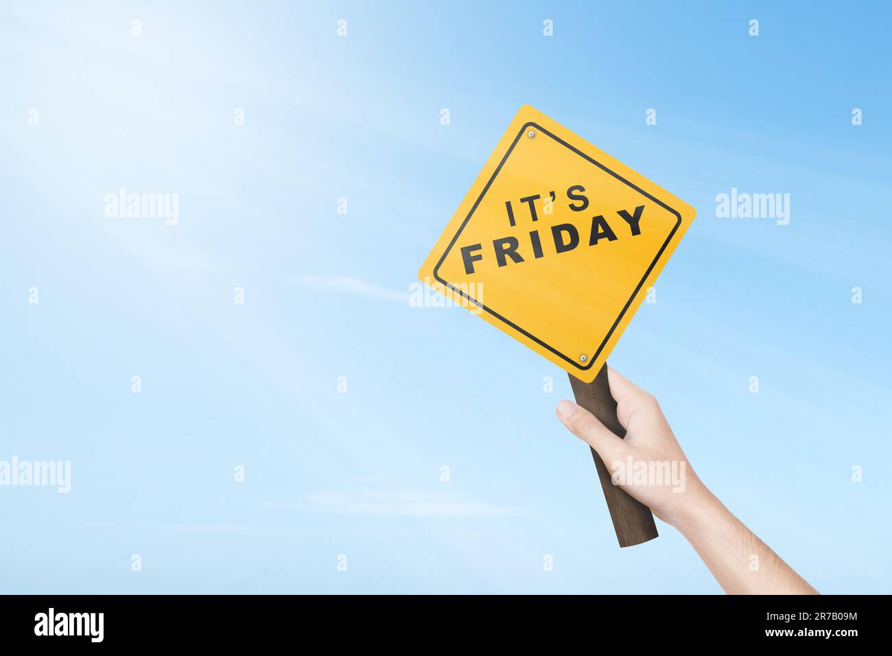 Human hand holding warning sign with It's Friday text. Happy Friday ...