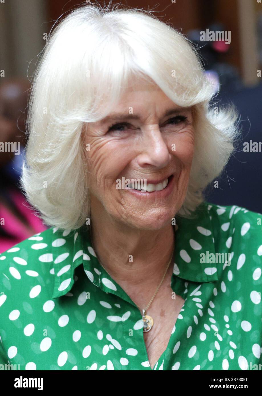 Queen Camilla smiles during a reception at Buckingham Palace in London ...