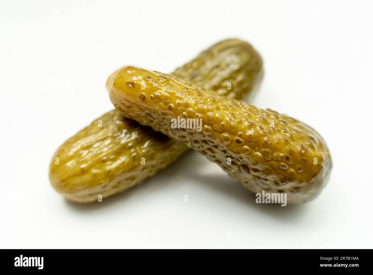 pickled gherkins on white Stock Photo - Alamy