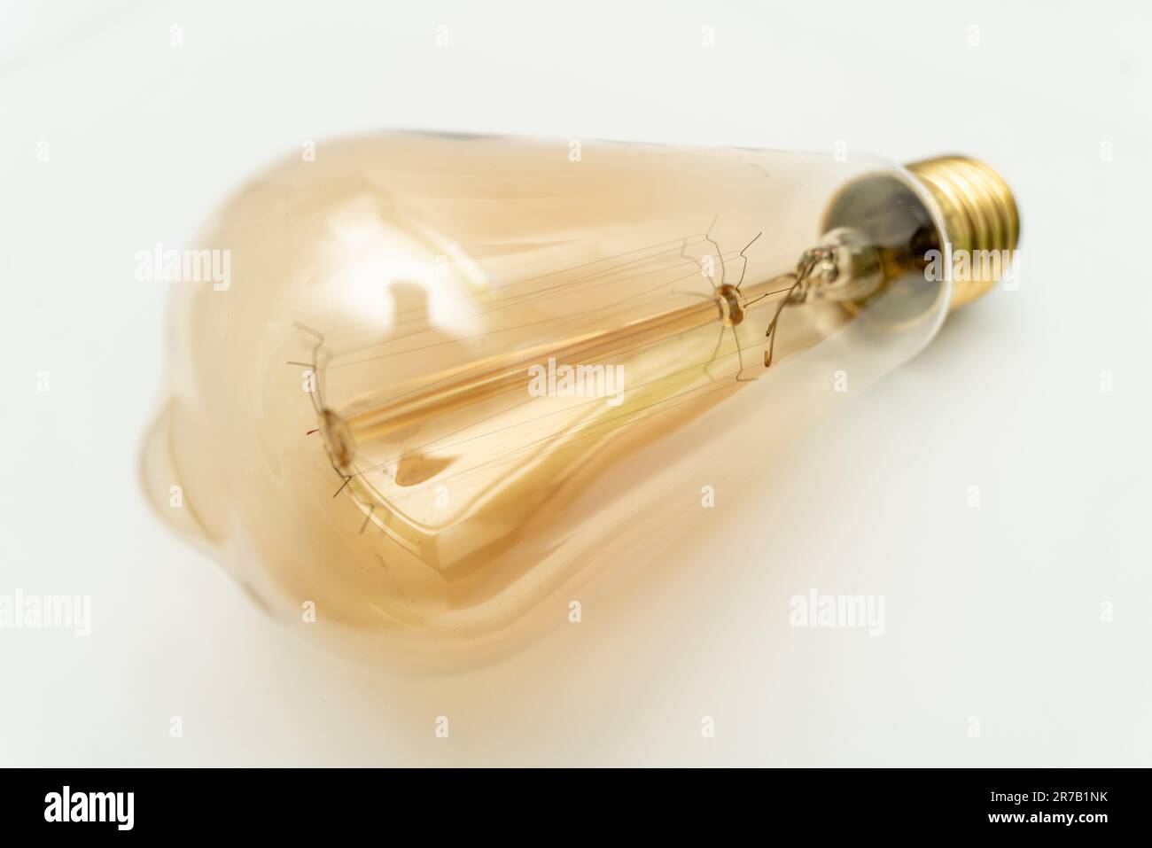 Vintage Edison lightbulb isolated on white Stock Photo - Alamy