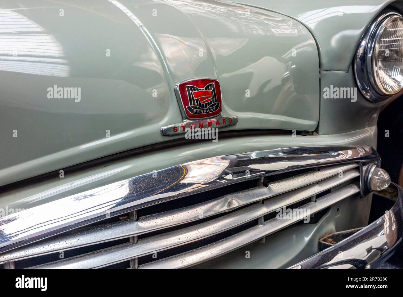 Detail of chrome radiator grille and headlight on a Standard Pennant a ...
