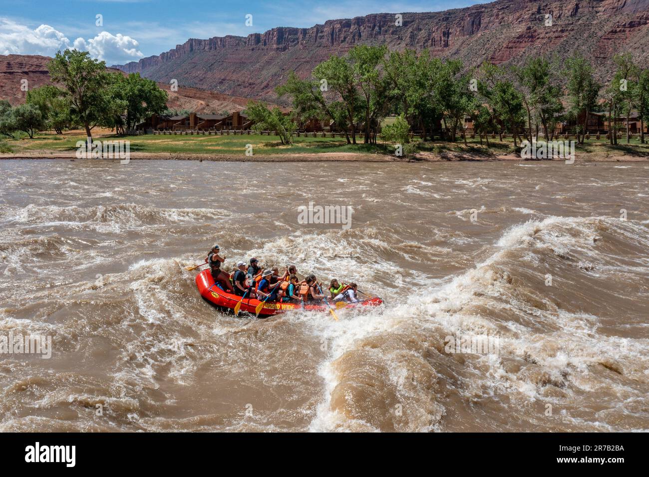 Tourists get splashed on a rafting trip through the big waves in White ...