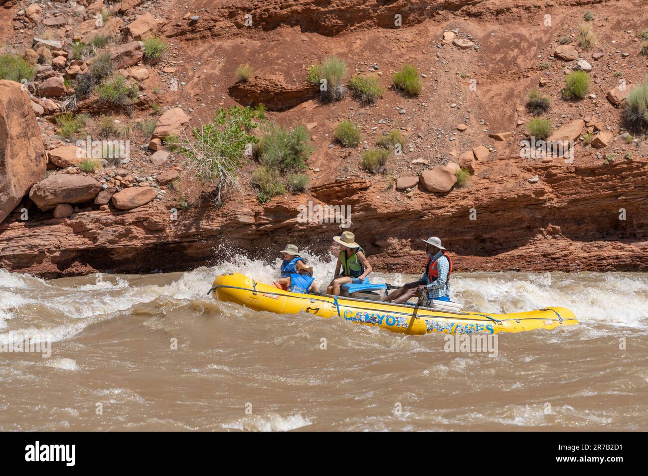 A mixed-race family in an inflatable raft in White's Rapid on the ...