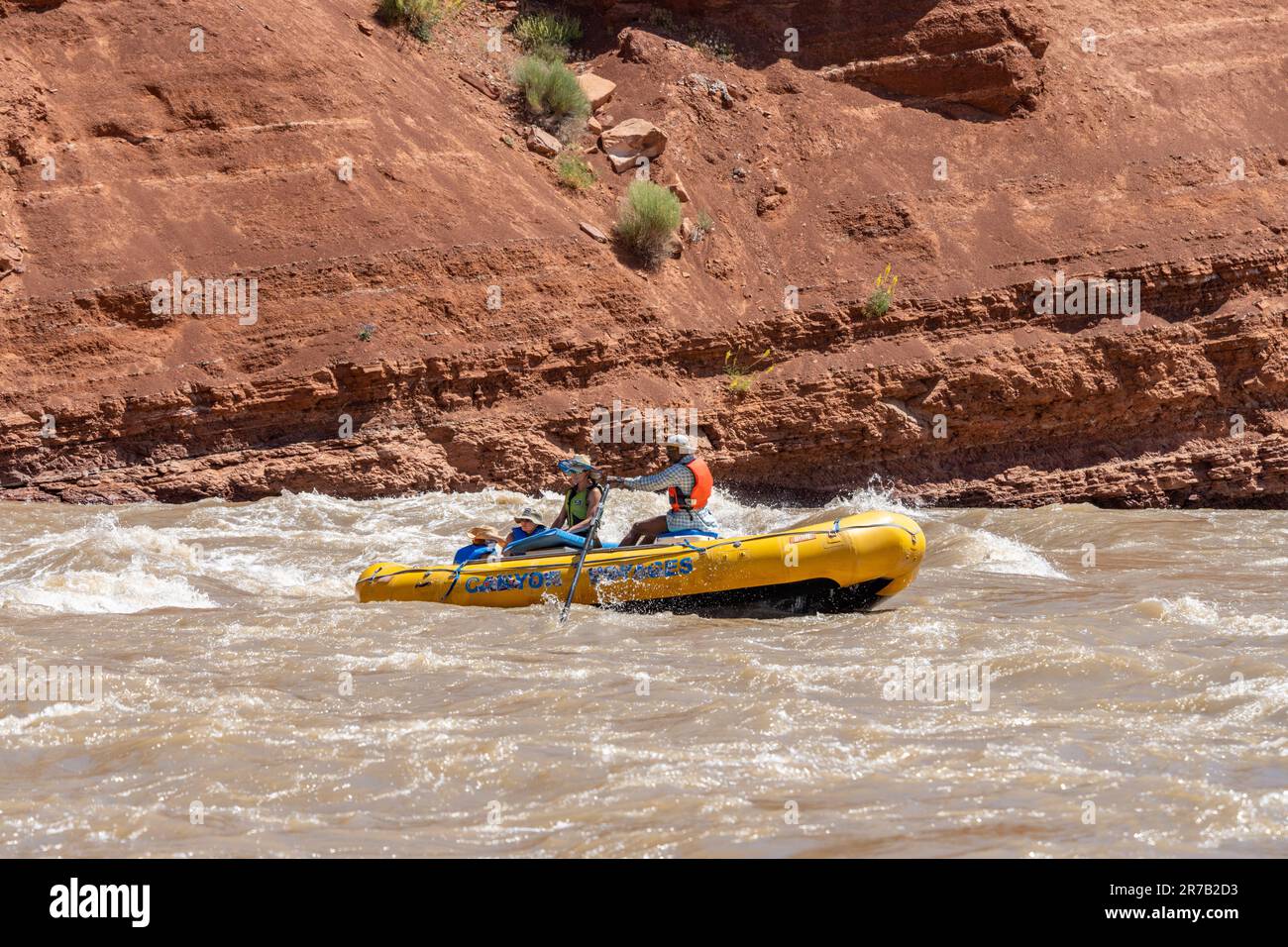 A mixed-race family in an inflatable raft in White's Rapid on the ...