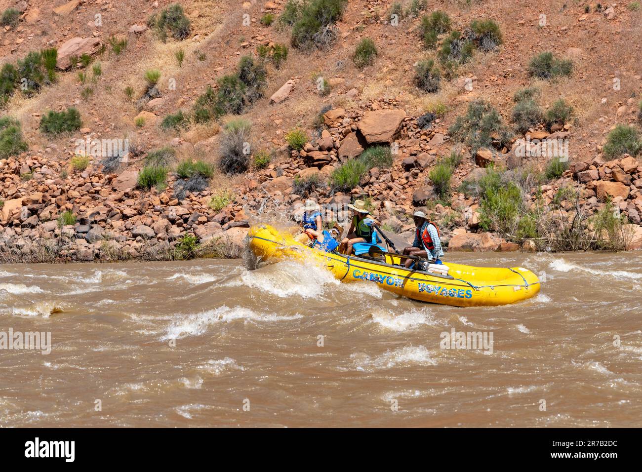 A mixed-race family in an inflatable raft in White's Rapid on the ...