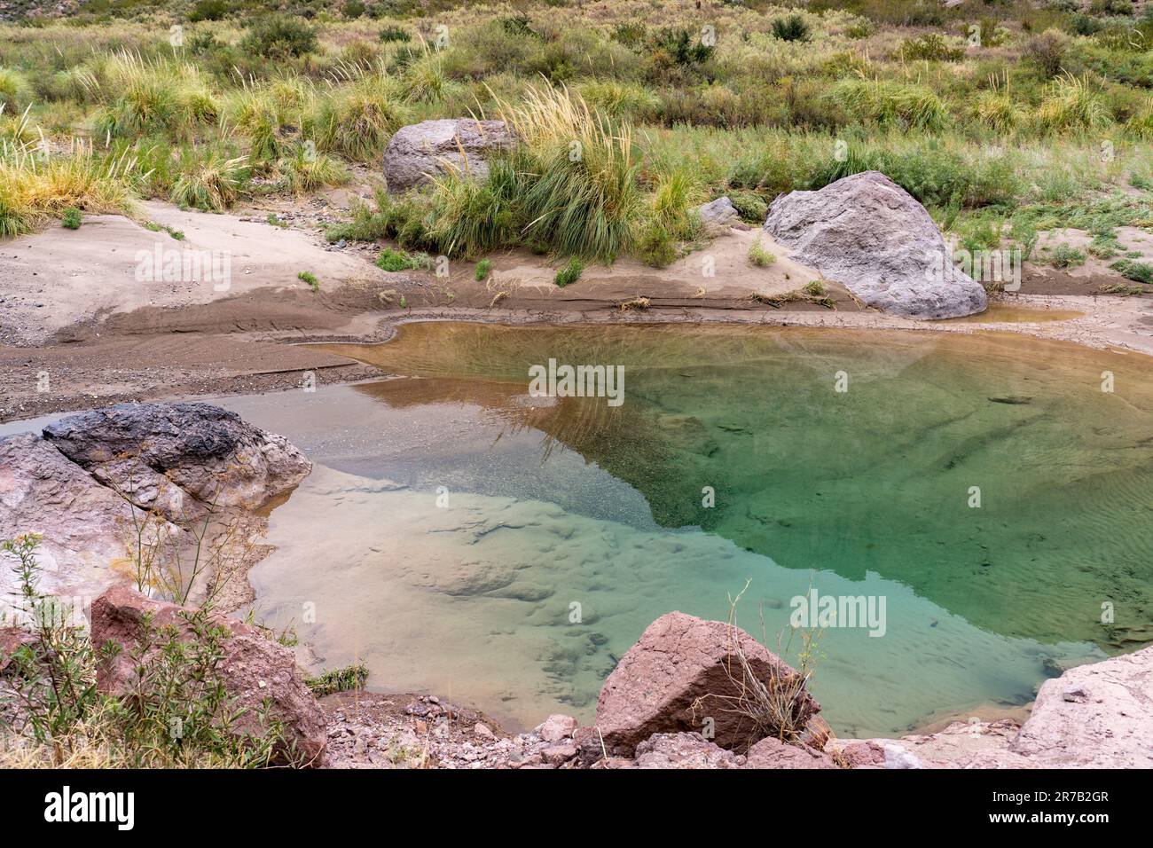 Canyon walls reflected in a pool in the Atuel River in dry season in ...