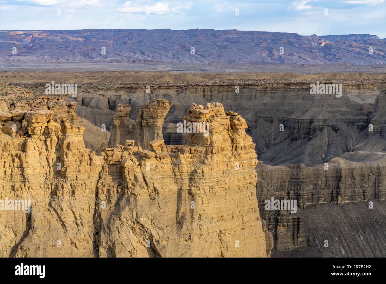 Early light on the cliffs of the Skyline Overlook. Factory Butte ...