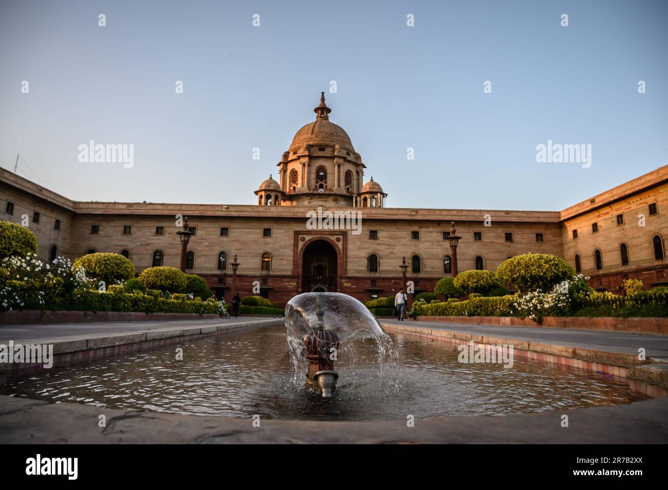 A picturesque courtyard with a majestic fountain situated in the center ...
