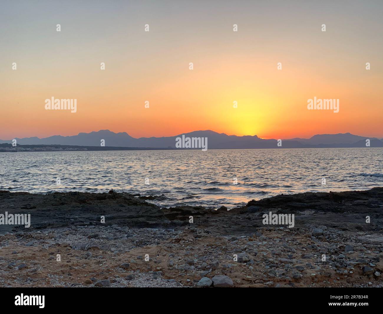 A breathtaking view of a sunset sky over the coast of Palma de Mallorca ...