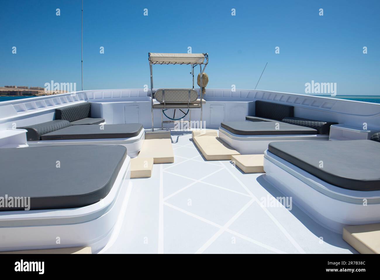 Sundeck of a large luxury motor yacht with sun lounger beds and ...