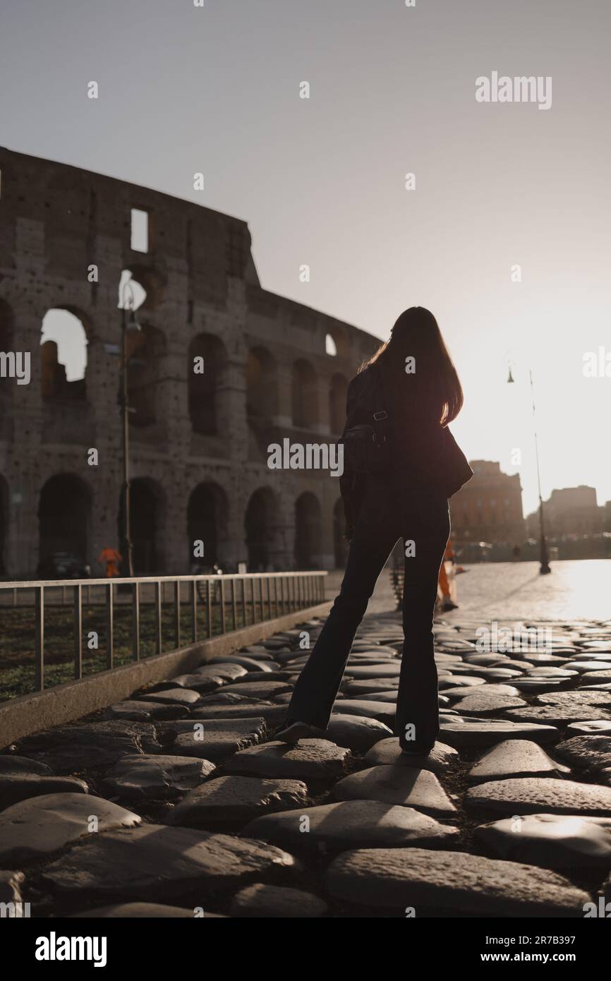 A young female posing in front of an ancient Roman structure Stock ...