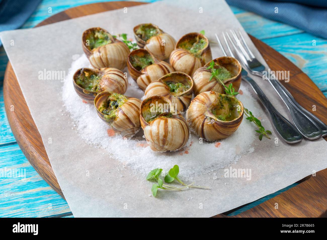 Baked snails with garlic butter and fresh herbs Stock Photo - Alamy