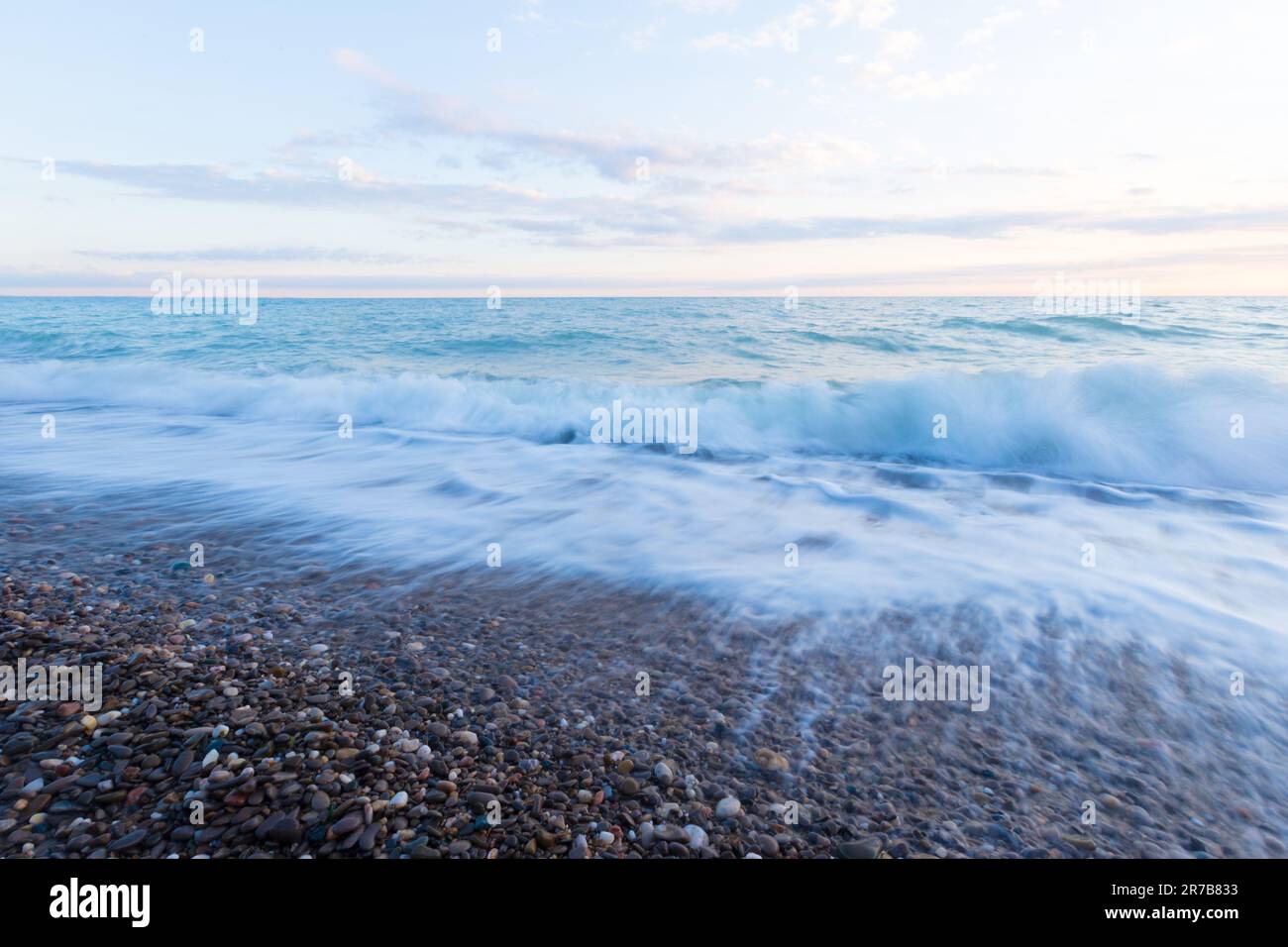 Sea surf on a stony beach Stock Photo - Alamy