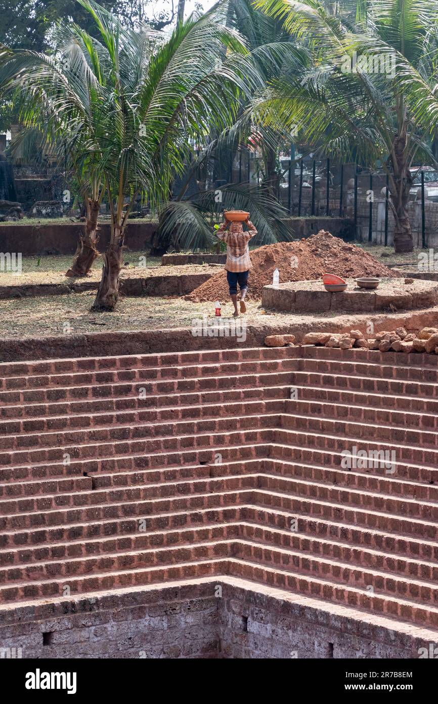 Old Goa, India - January 2023: A labourer working on the restoration of ...