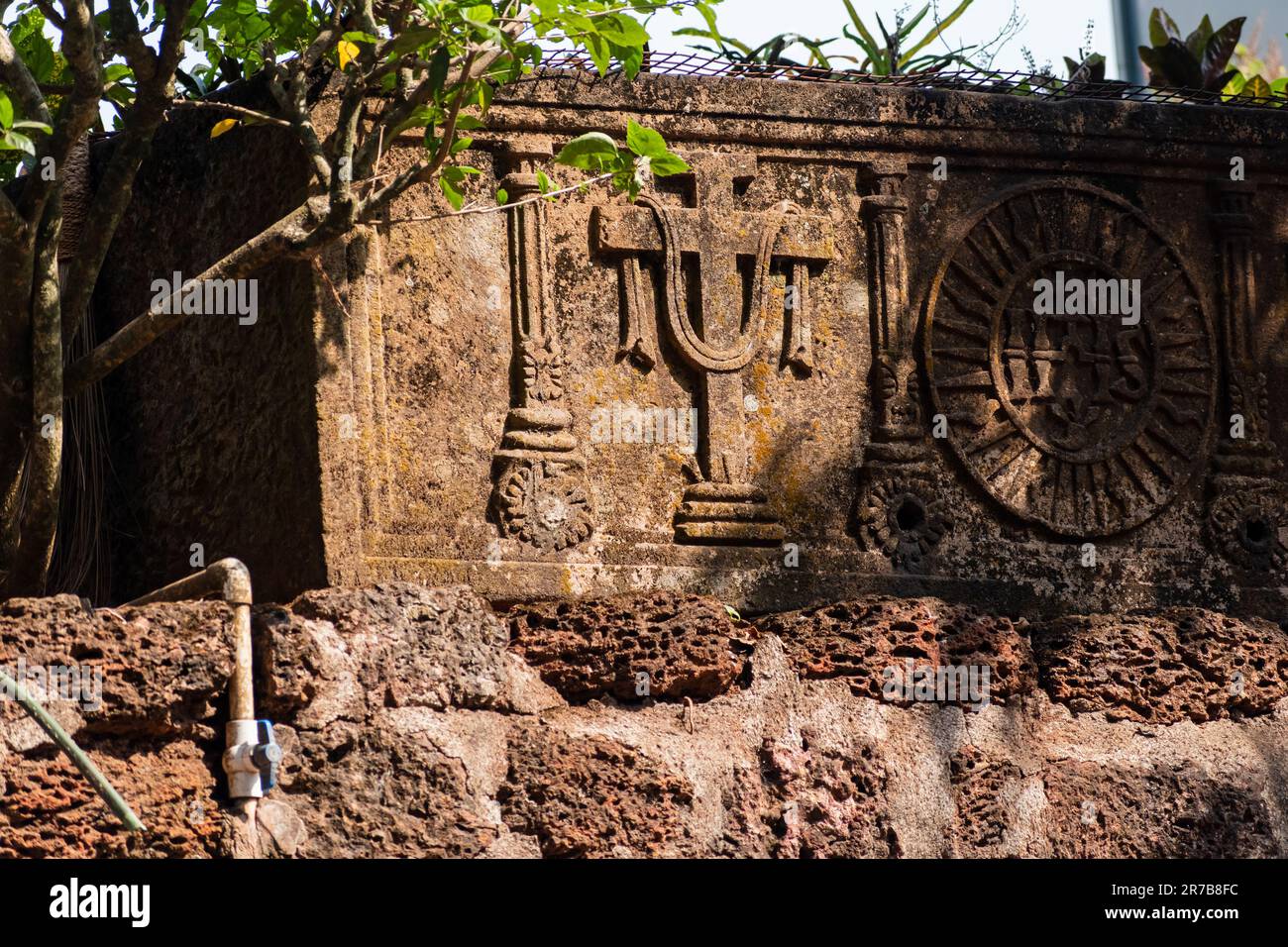 An old Portuguese era stone carving in the ruins of a church at the ...