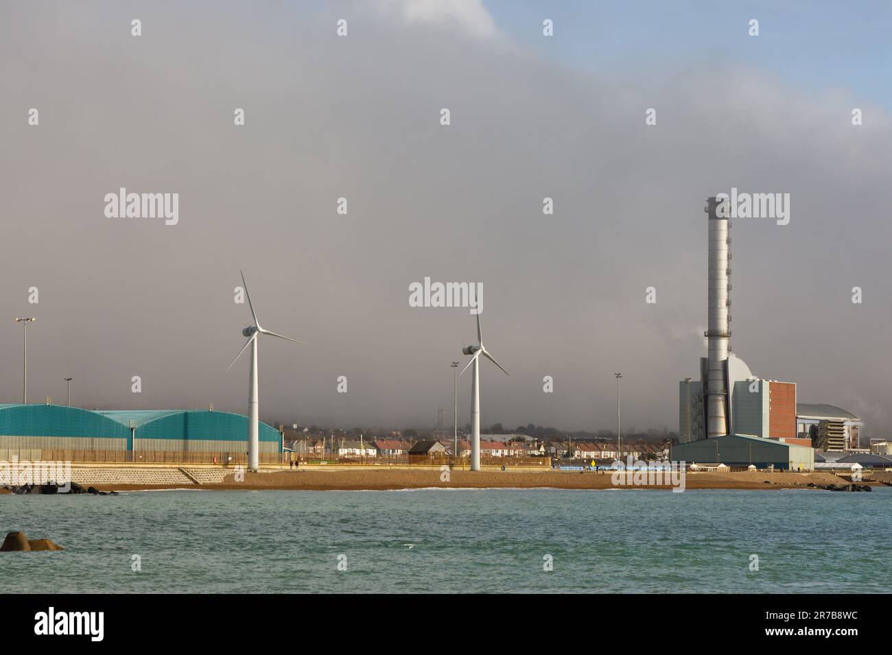 Shoreham Harbour in West Sussex, England. Wind turbines and gas powered ...