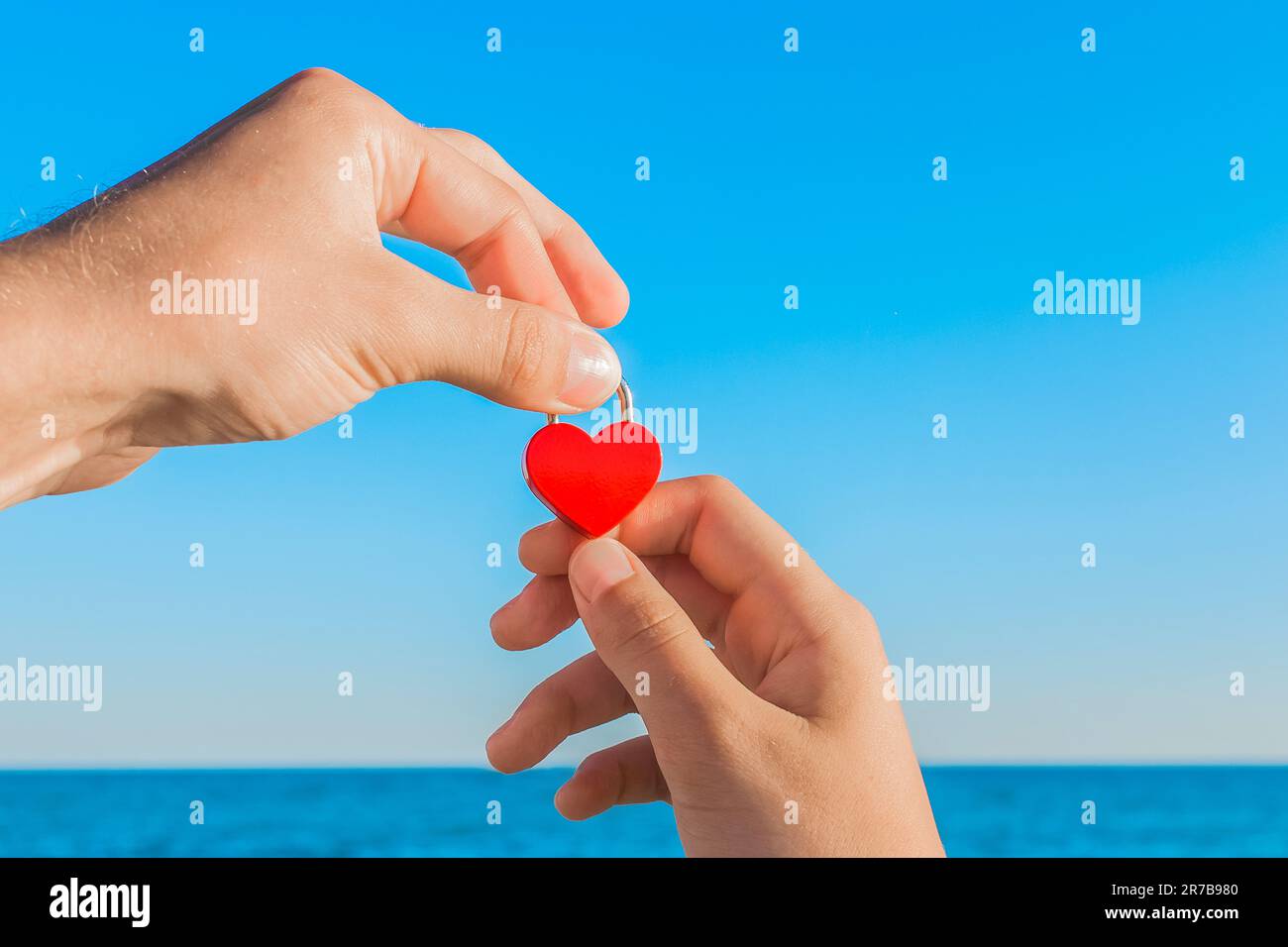 A sign and symbol of love and relationship concept. The hands of a man ...