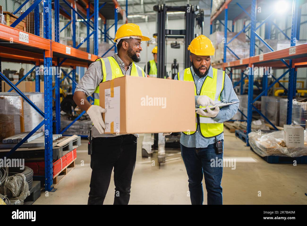 Warehouse workers checking and controlling boxes in warehouse Stock ...