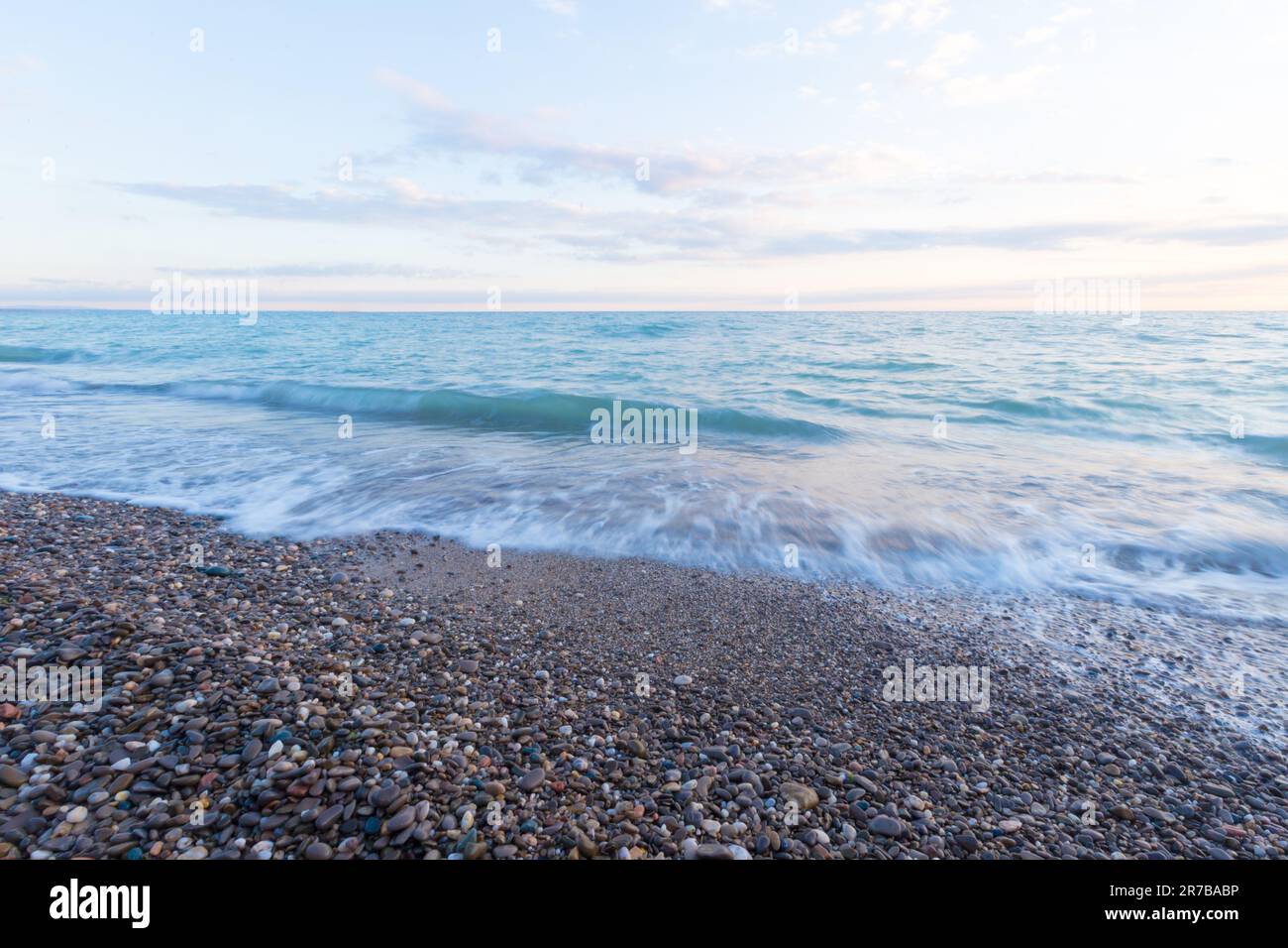 Sea surf on a stony beach Stock Photo - Alamy