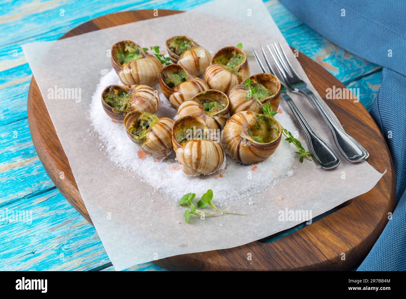 Baked snails with garlic butter and fresh herbs Stock Photo - Alamy