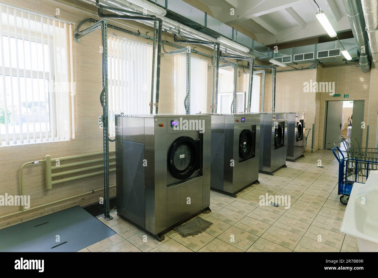 Line of laundry machine, washing machines. Automate equipment Stock ...
