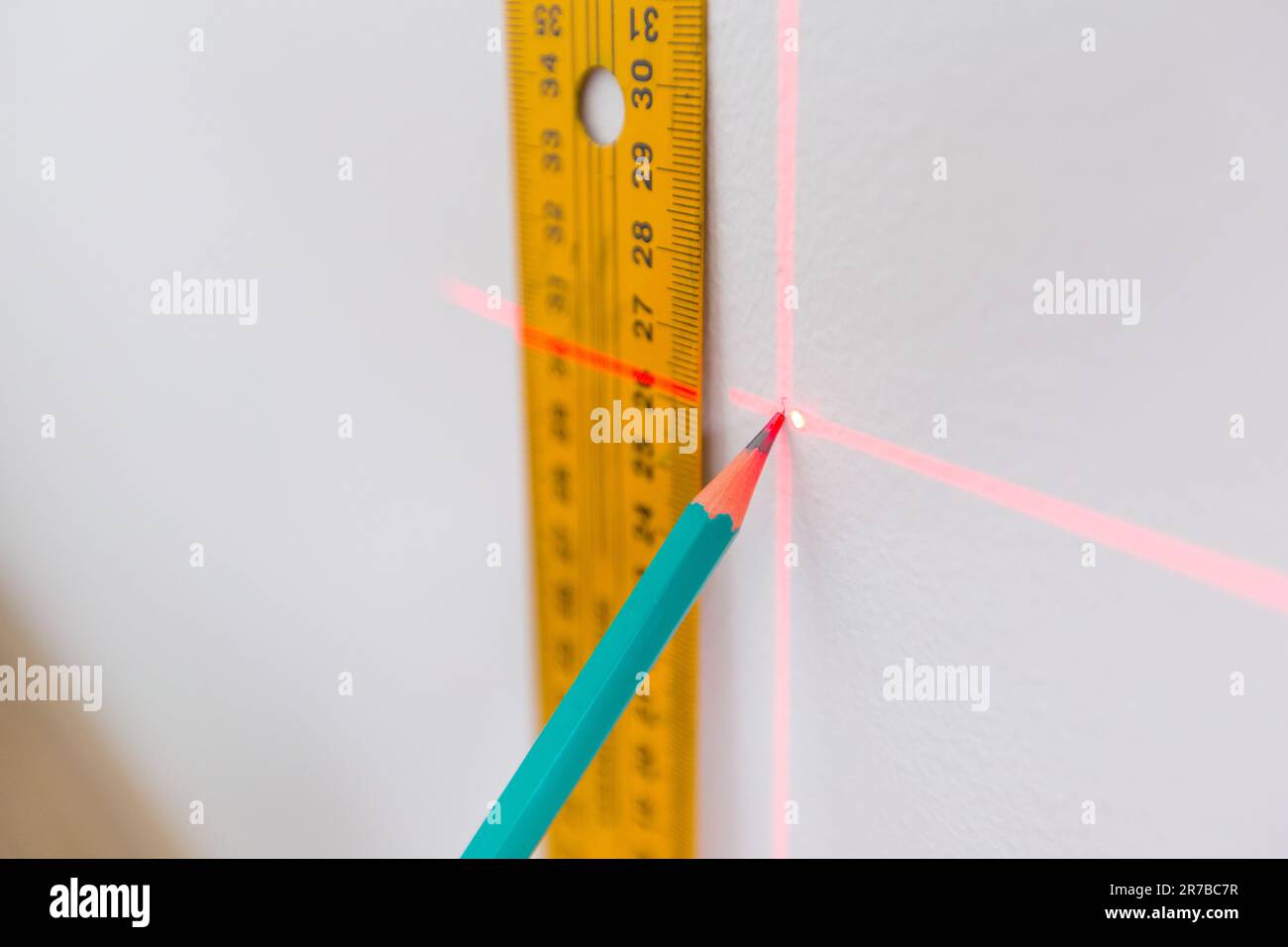 Laser level and lines on the wall Stock Photo - Alamy
