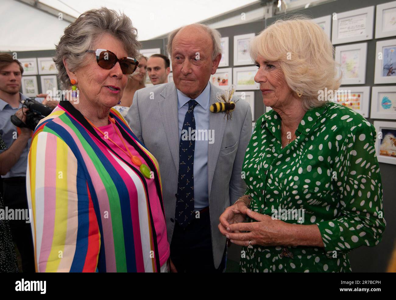Queen Camilla speaks with Prue Leith (left) and Charlie Ross (centre ...