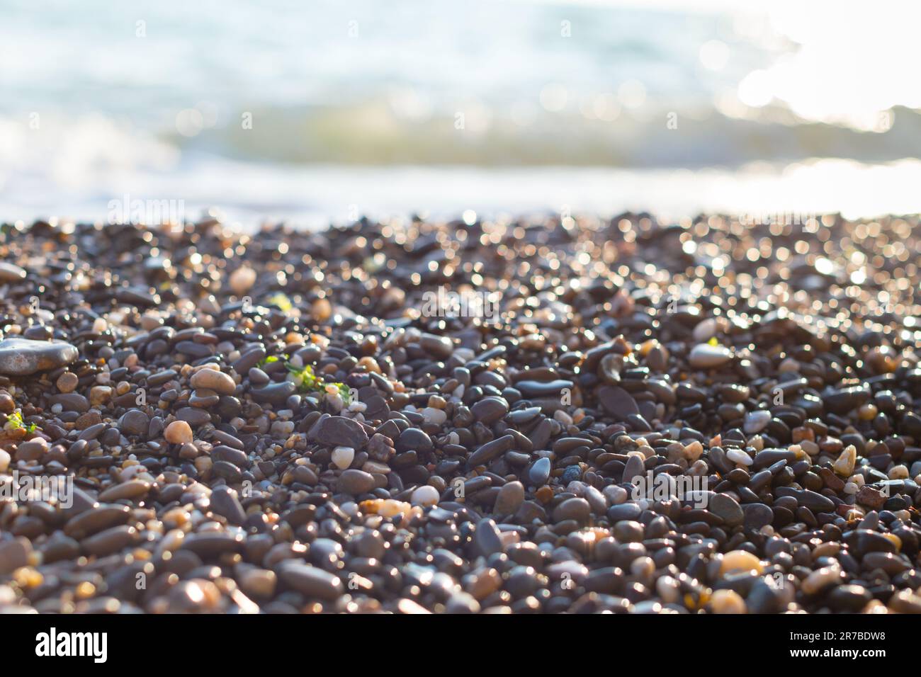 Natural colorful stone on the beach Stock Photo - Alamy