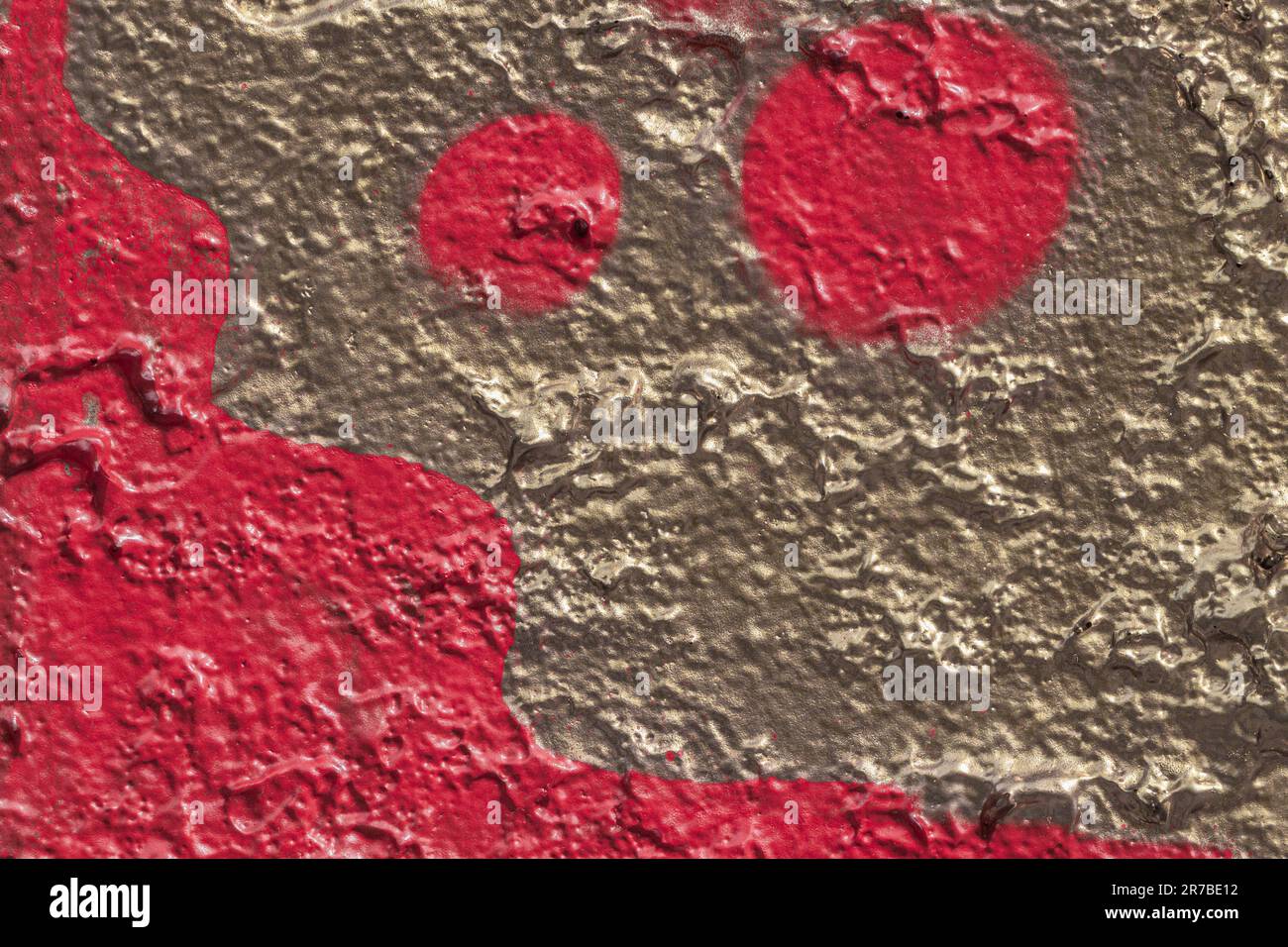 Abstract fragment of wall with detail of graffiti, old chipped paint ...