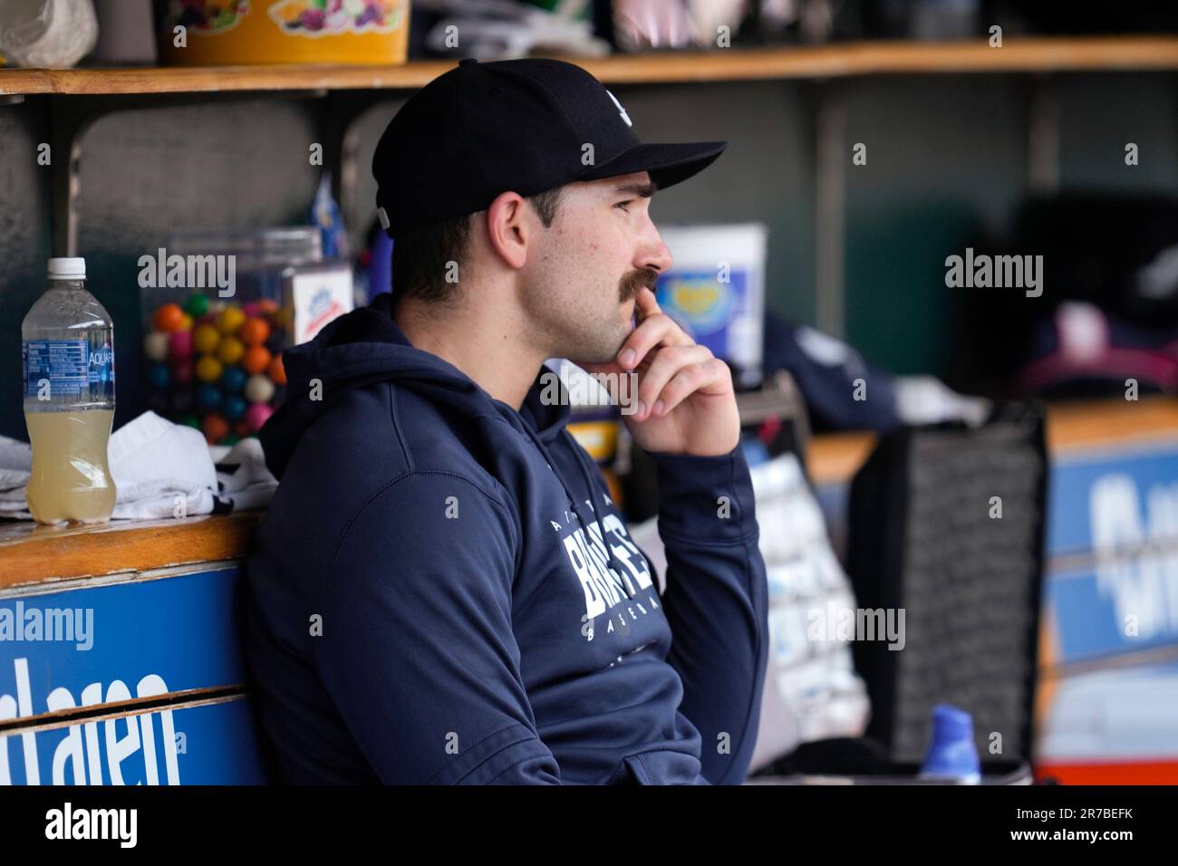 Atlanta Braves pitcher Spencer Strider sits in the dugout against the ...