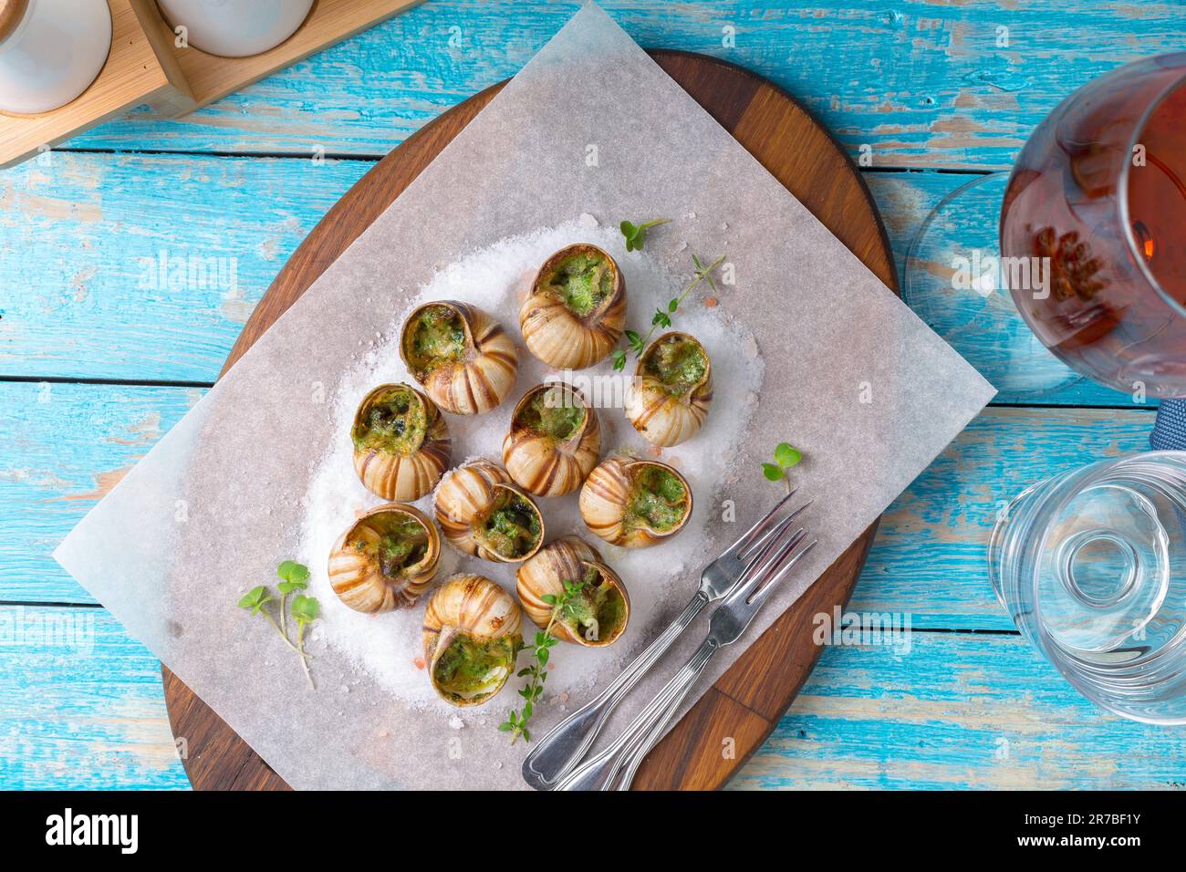 Baked snails with garlic butter and fresh herbs Stock Photo - Alamy