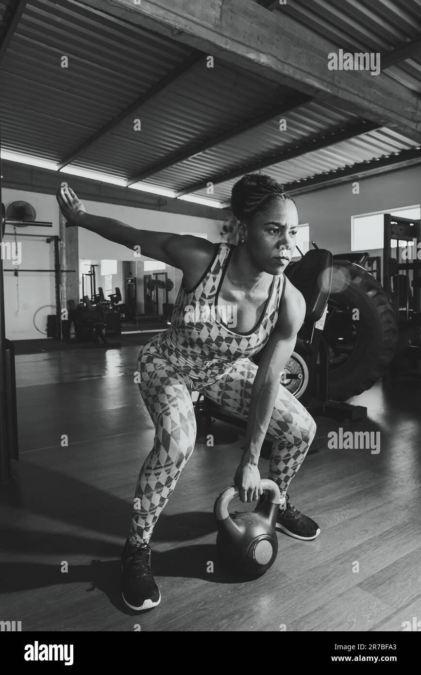 A young African-American female is actively working out in a gym Stock ...