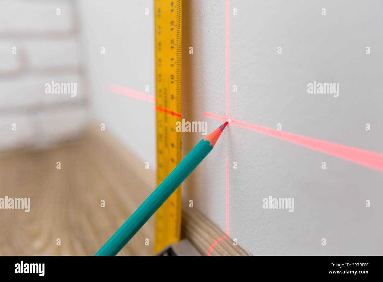 Laser level and lines on the wall Stock Photo - Alamy