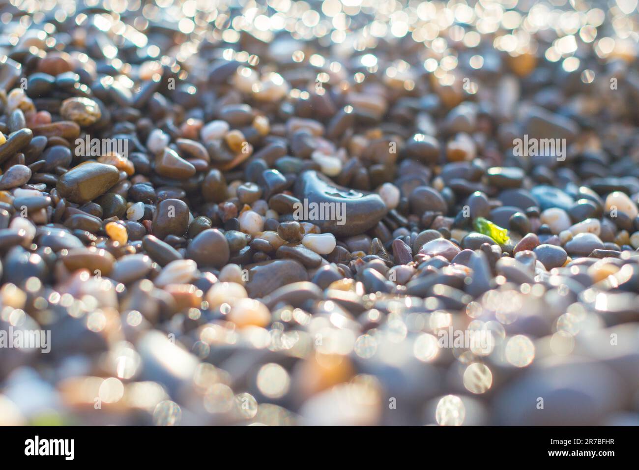 Natural colorful stone on the beach Stock Photo - Alamy