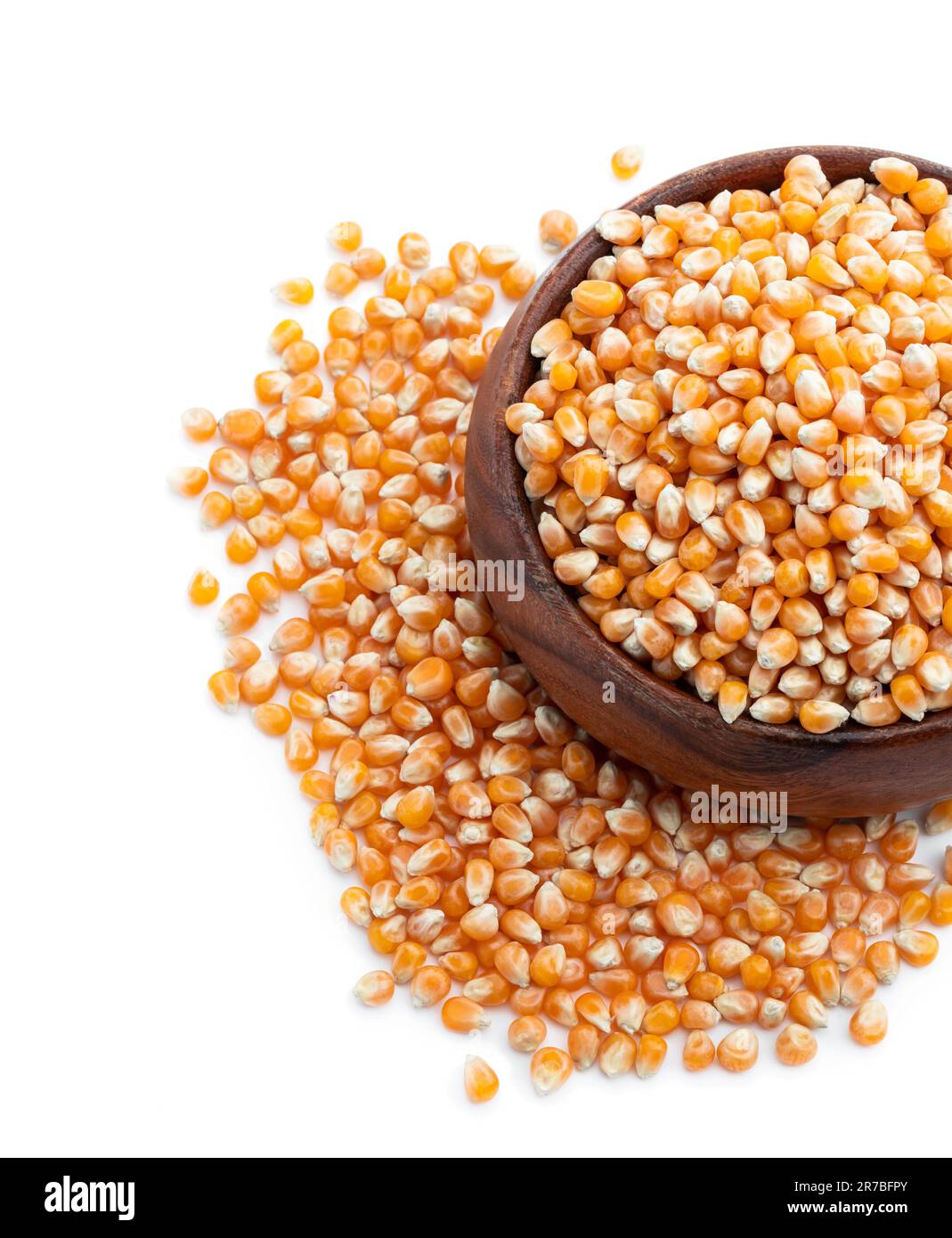 Dried corn kernels in wooden bowl isolated on white Stock Photo - Alamy