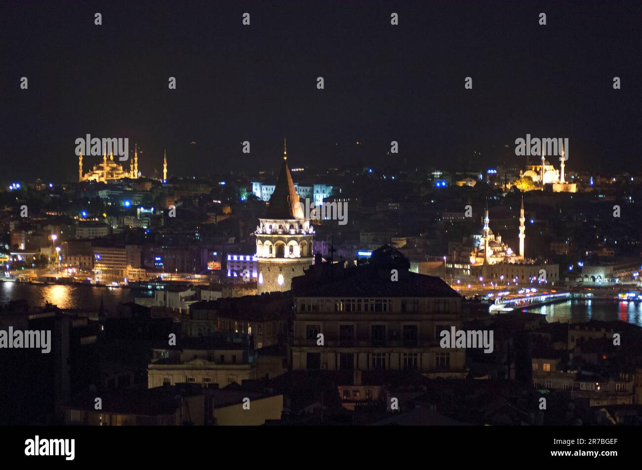 Rooftop view at night of Galata Tower and the Blue Mosque and Hagia ...