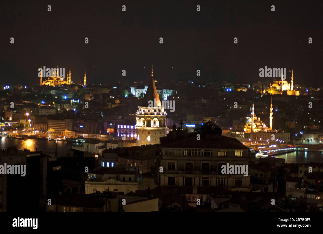 Rooftop view at night of Galata Tower and the Blue Mosque and Hagia ...
