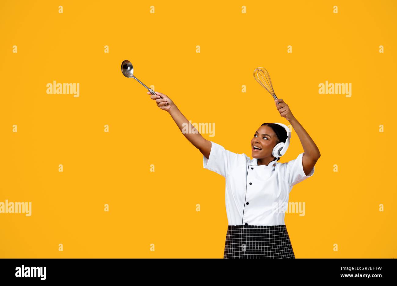 Happy Black Chef Woman In Headphones Dancing On Yellow Studio ...