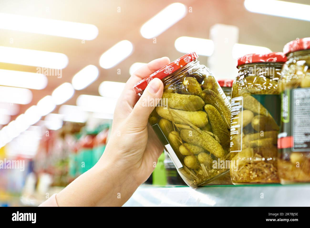 Pickled cucumbers in a jar in a store Stock Photo - Alamy