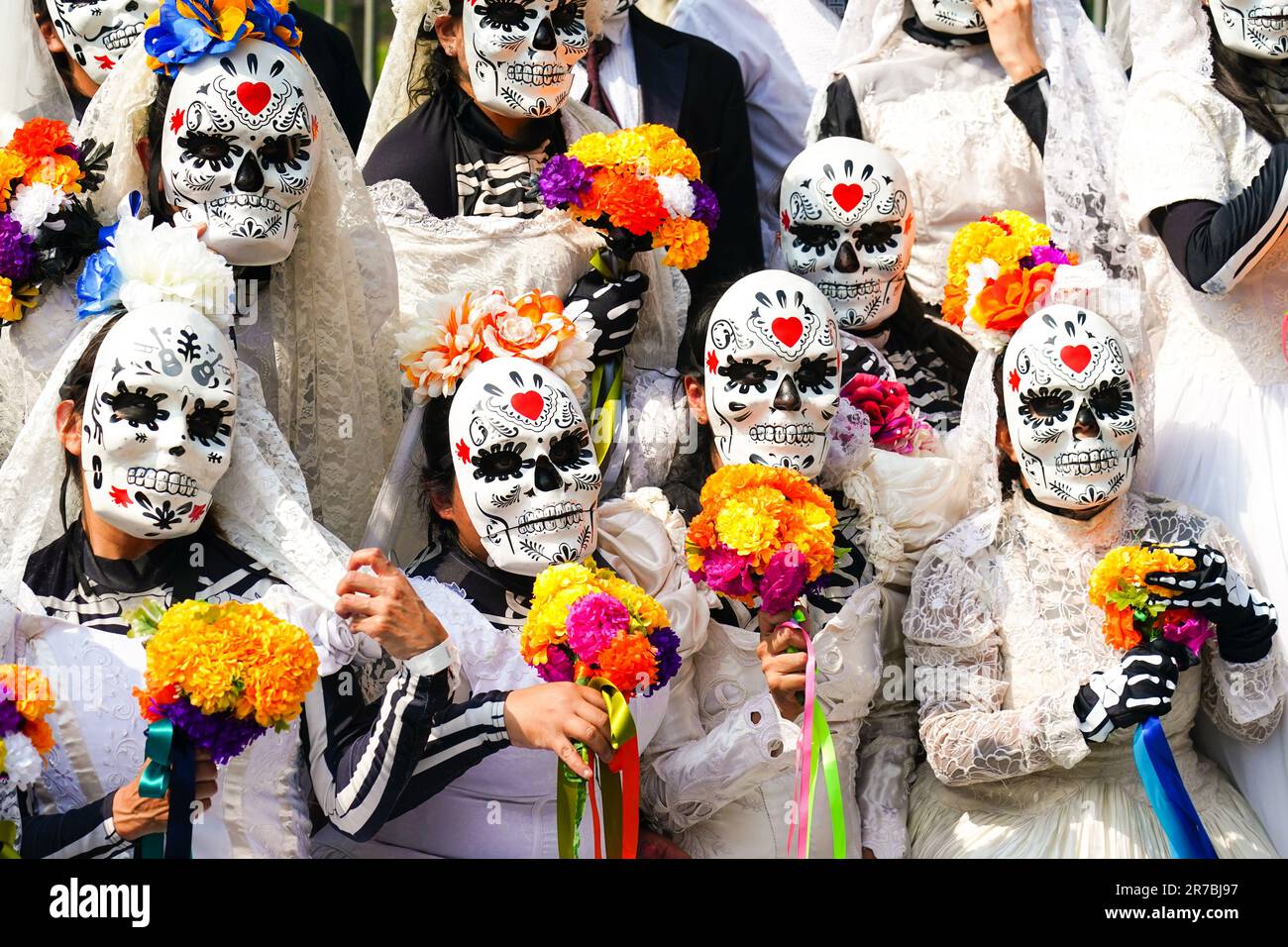 Skeleton Catrina brides pose together during the Grand Parade ...