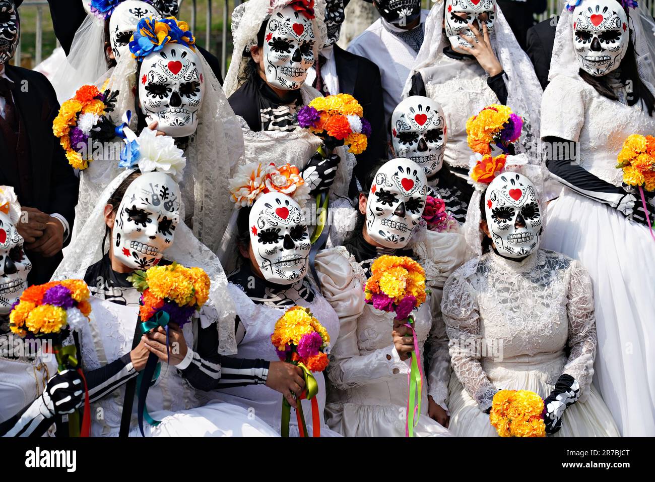 Skeleton Catrina brides pose together during the Grand Parade ...