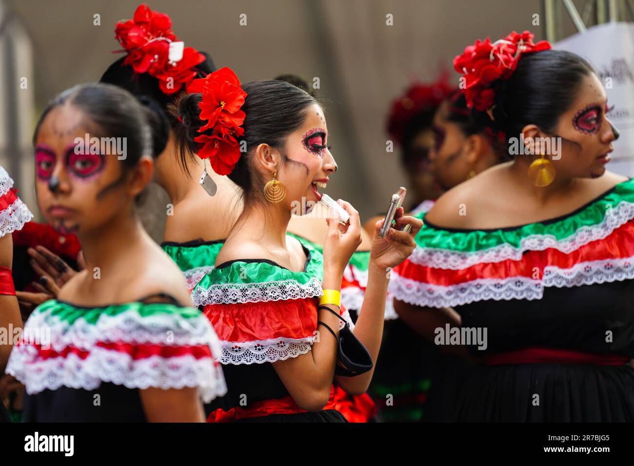 Traditional Mexican dancers dressed in skeleton costumes prepare for ...